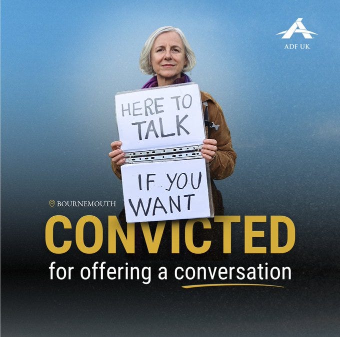 Woman Found Guilty of Holding Up Sign Saying ‘Here to talk, if you want ...