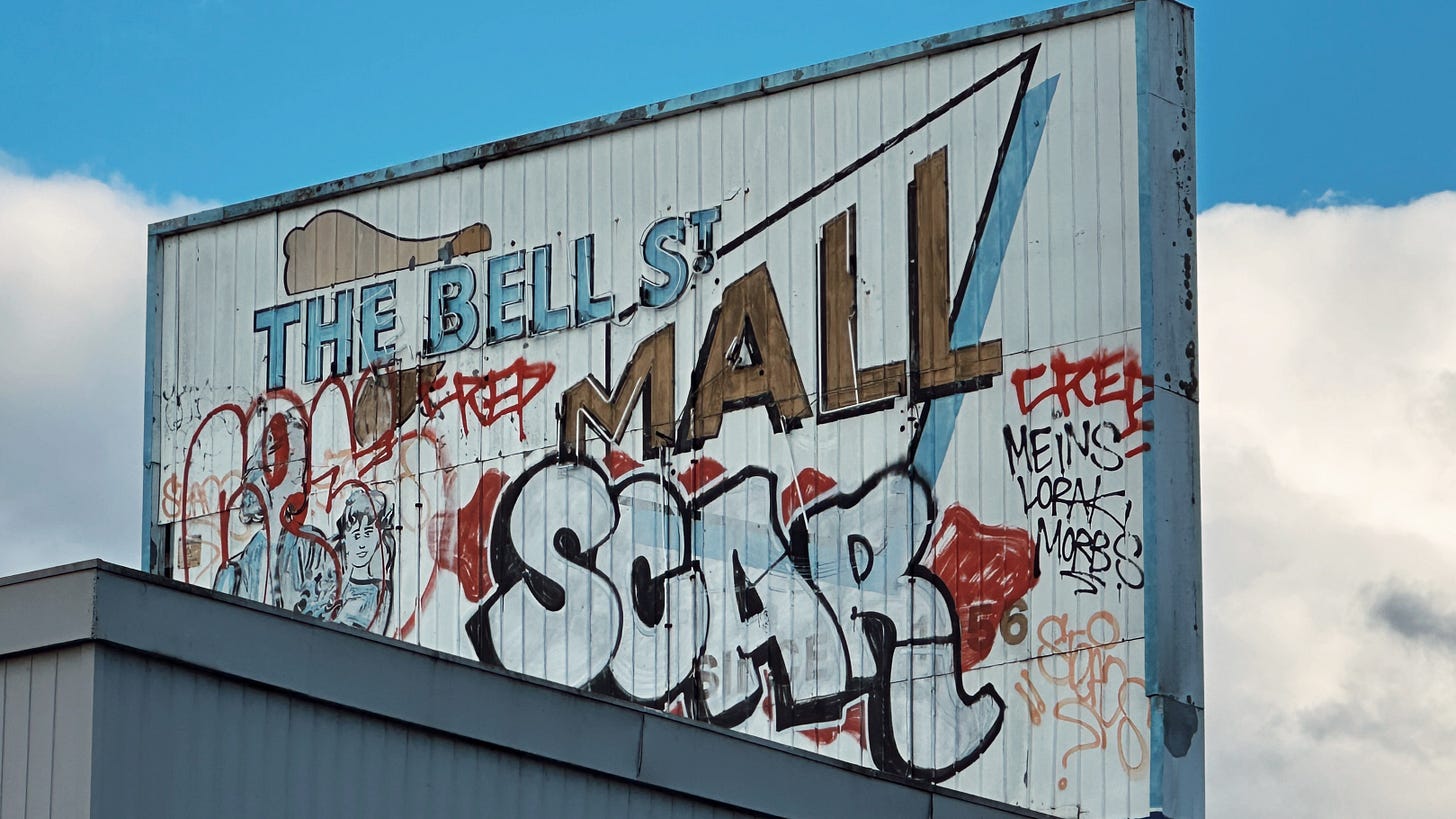 From Olympic Dreams to Neon Nightmares: Bell Street Mall
