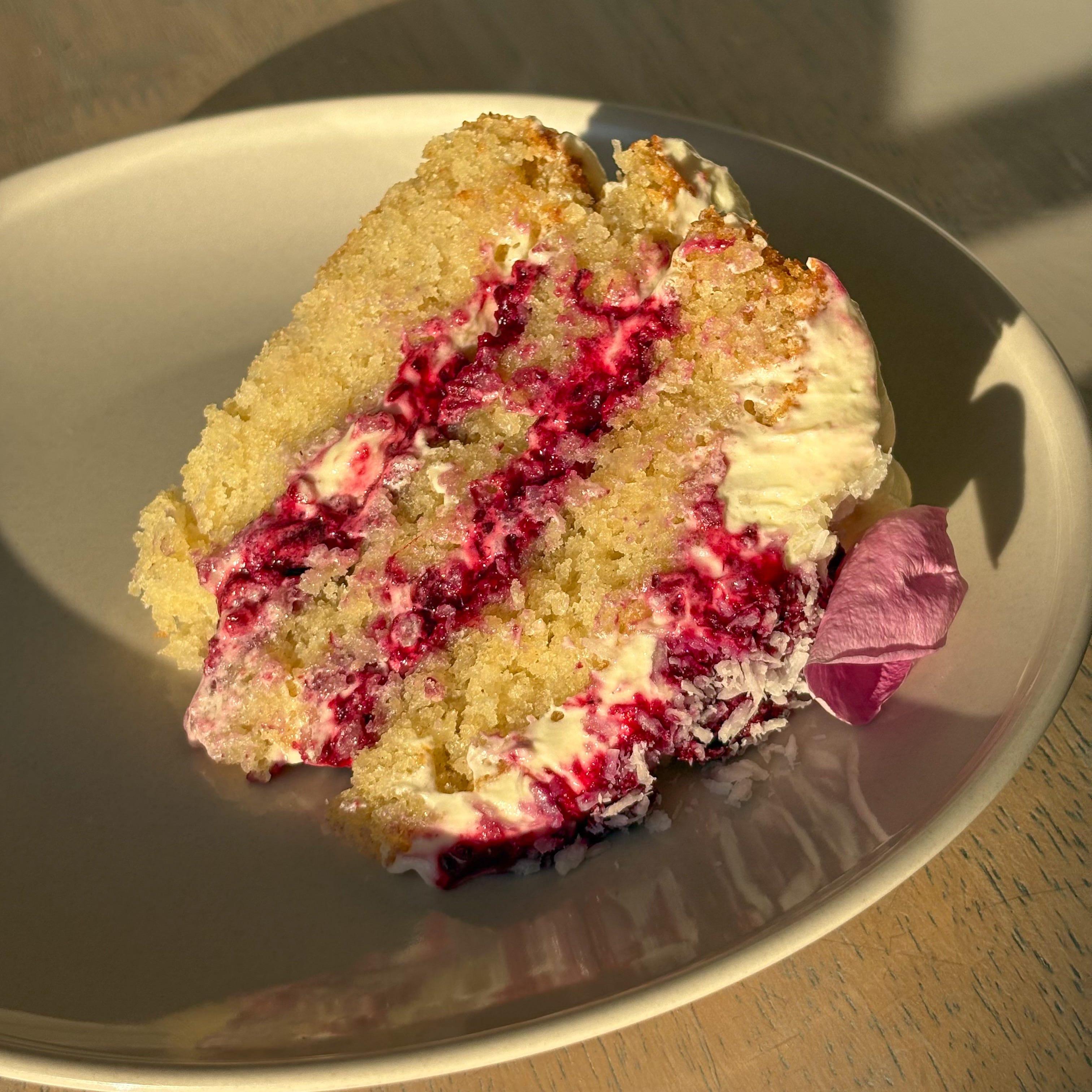 Coconut Sponge, Coconut Cream, Raspberry, Rose and Blackberry Filling.