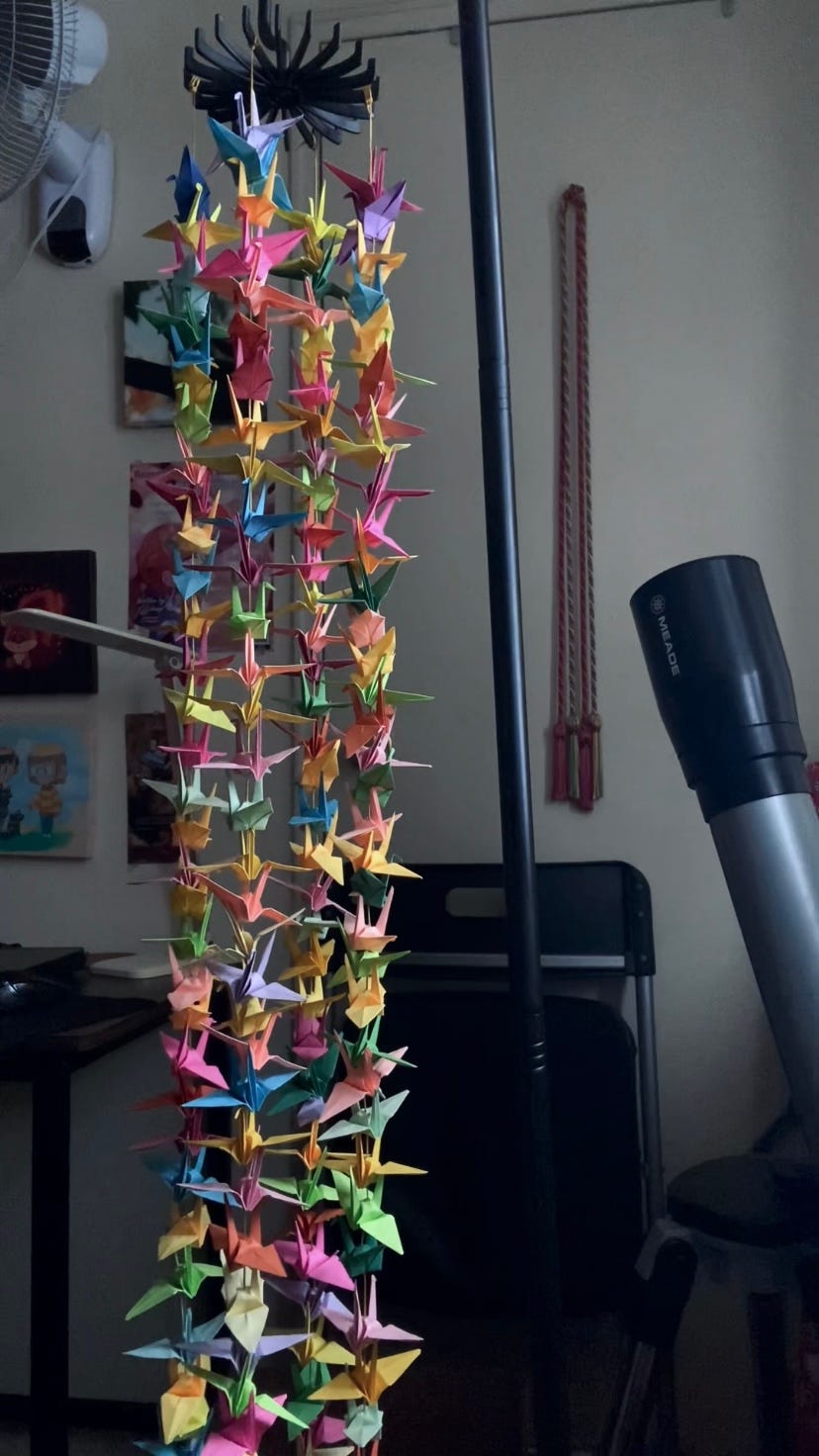 stringing paper cranes - by t.j. zhang
