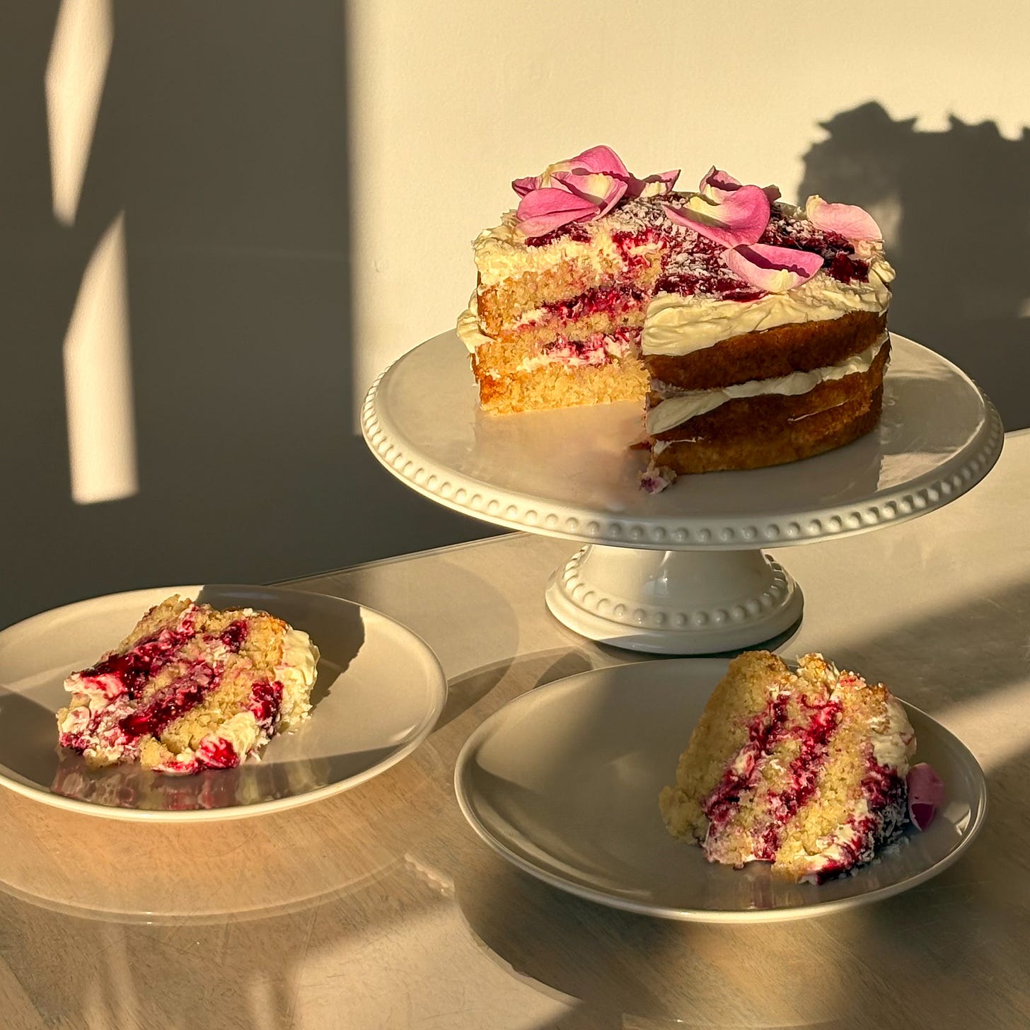 Coconut Sponge, Coconut Cream, Raspberry, Rose and Blackberry Filling.
