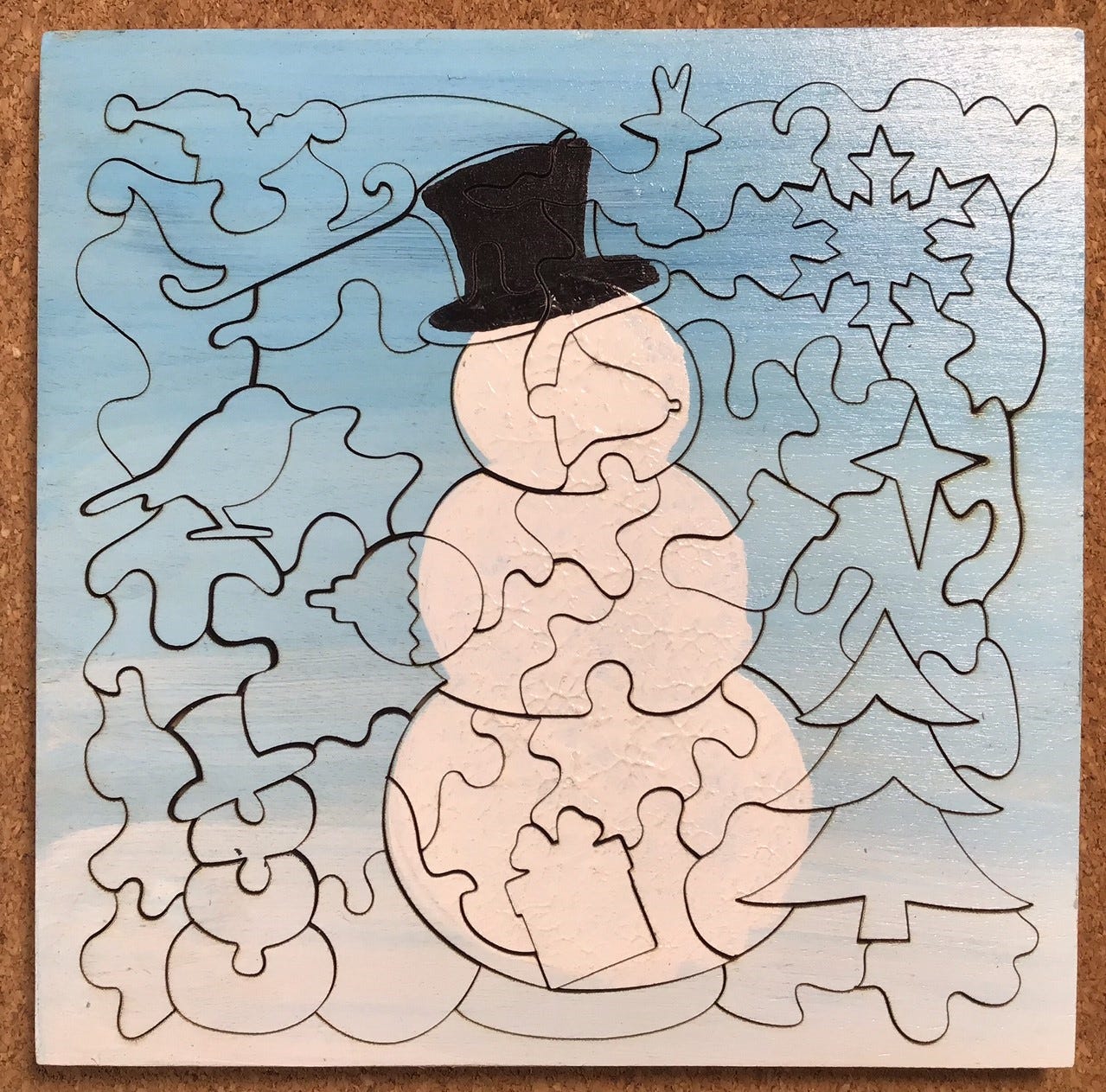 17. A singing snowman and jigsaw puzzle - by Bill Huot
