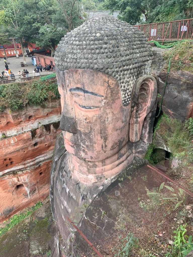 Visiting the Leshan Giant Buddha. - by Patrick O'Hearn