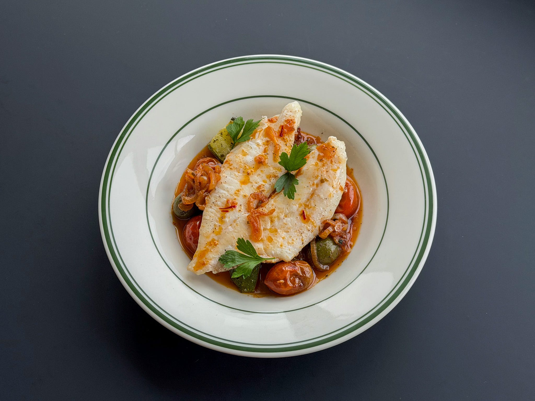 Steamed Fish with Saffron-Infused Champagne Sauce and Cherry Tomatoes