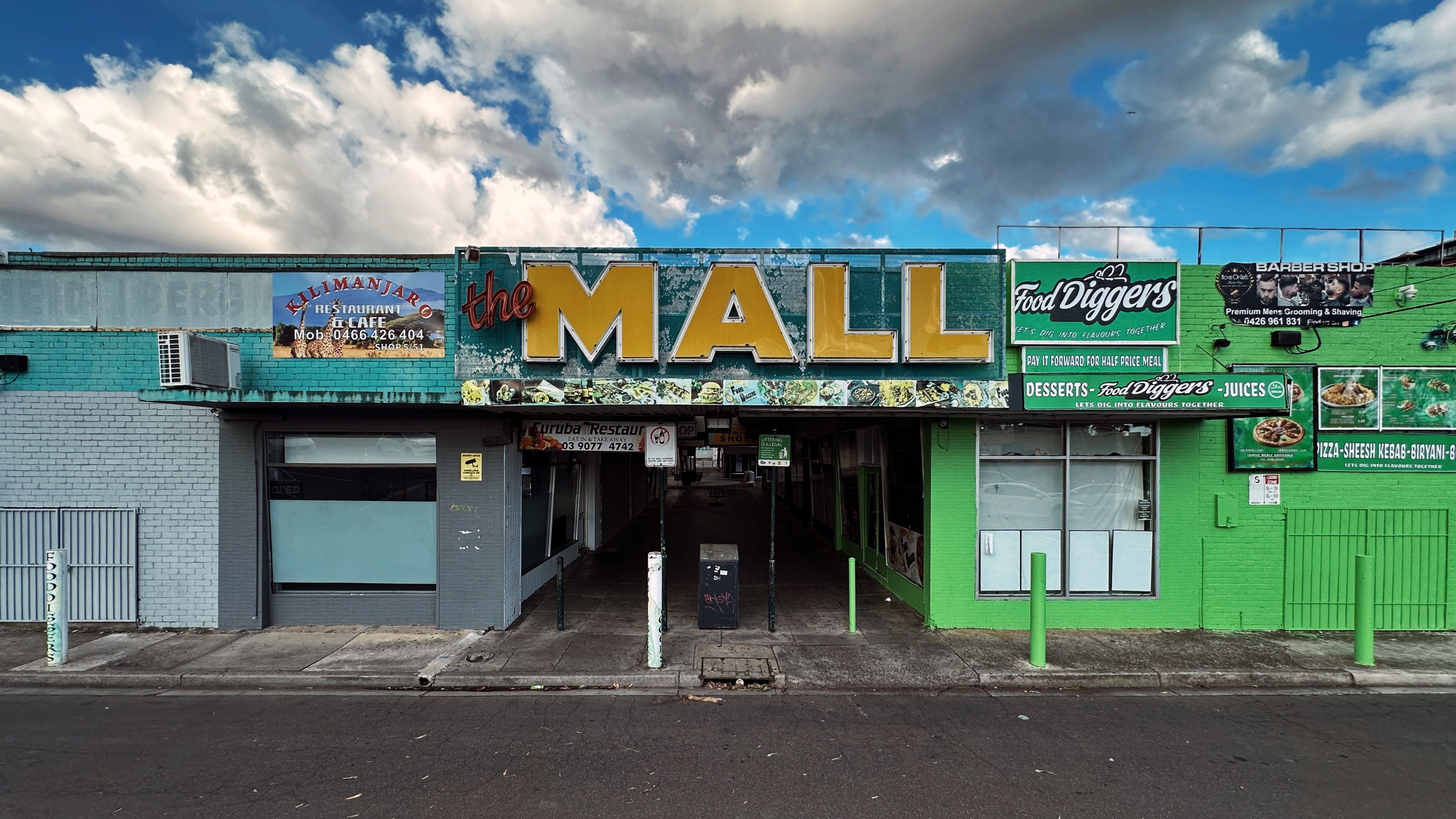 From Olympic Dreams to Neon Nightmares: Bell Street Mall