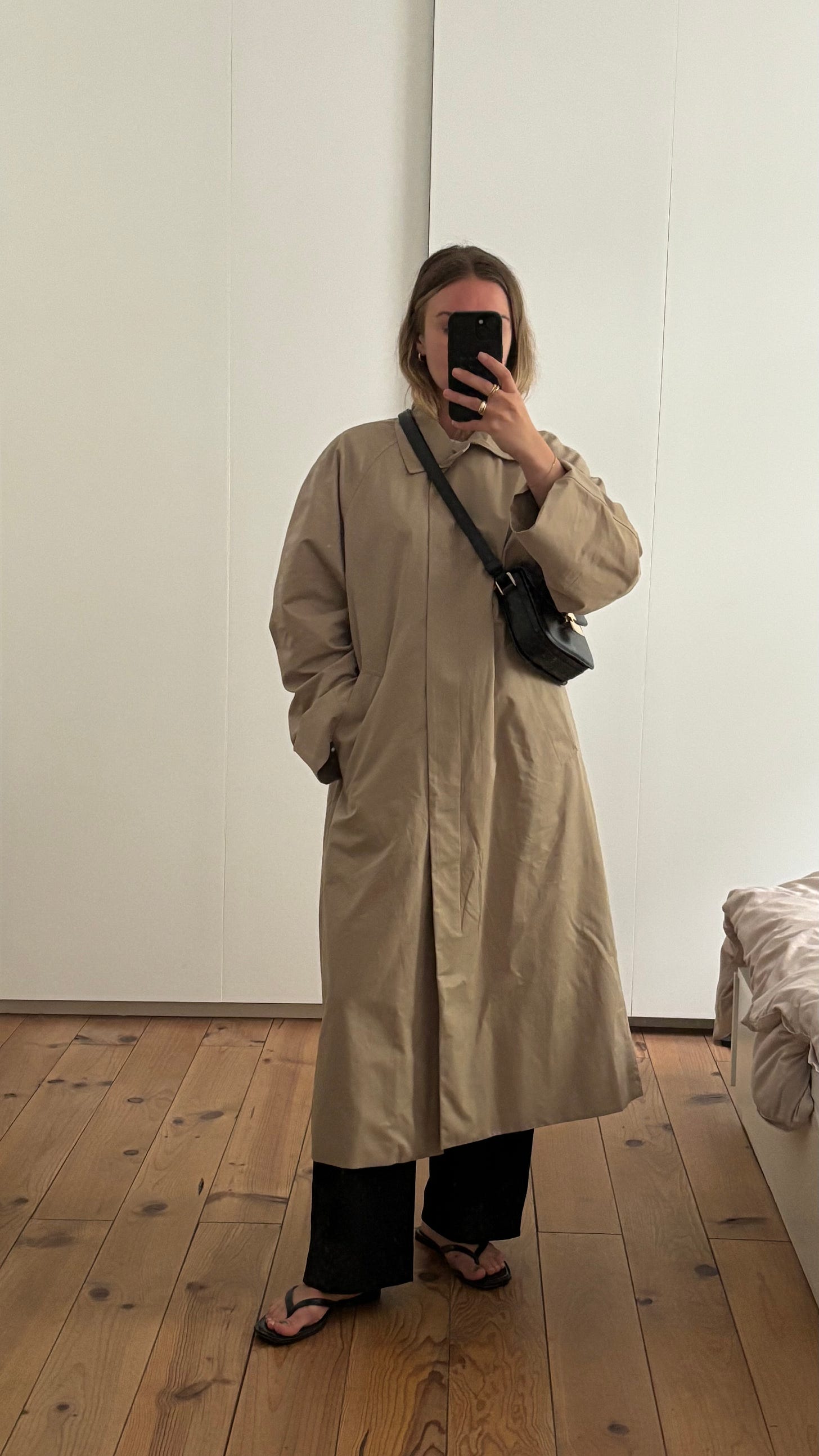 trench coat buttoned to the top