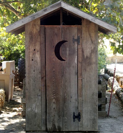 WHY WERE THERE MOONS ON OUTHOUSE DOORS?