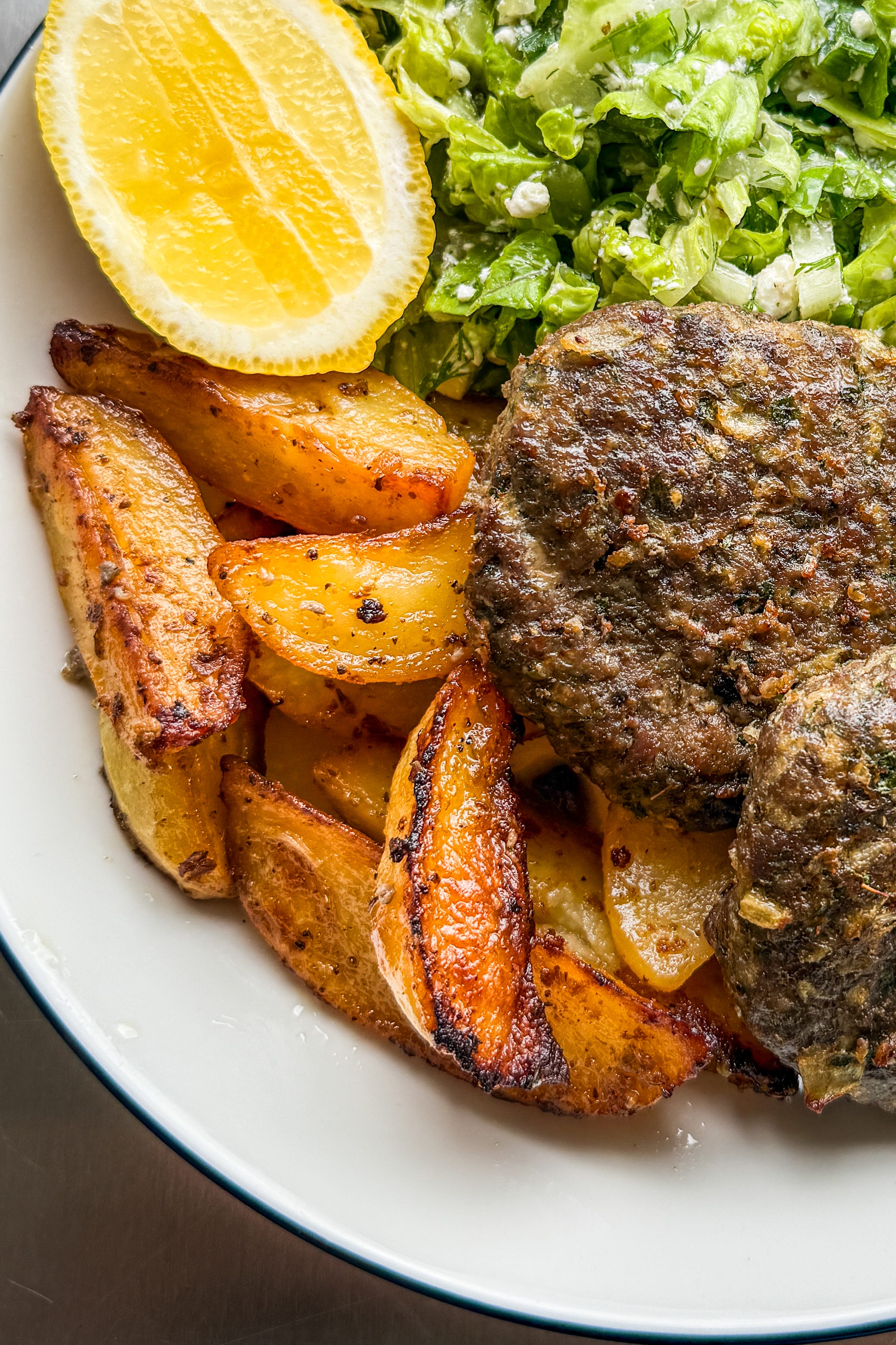 Greek Biftekia with Lemon Roasted Potatoes and Maroulosalata