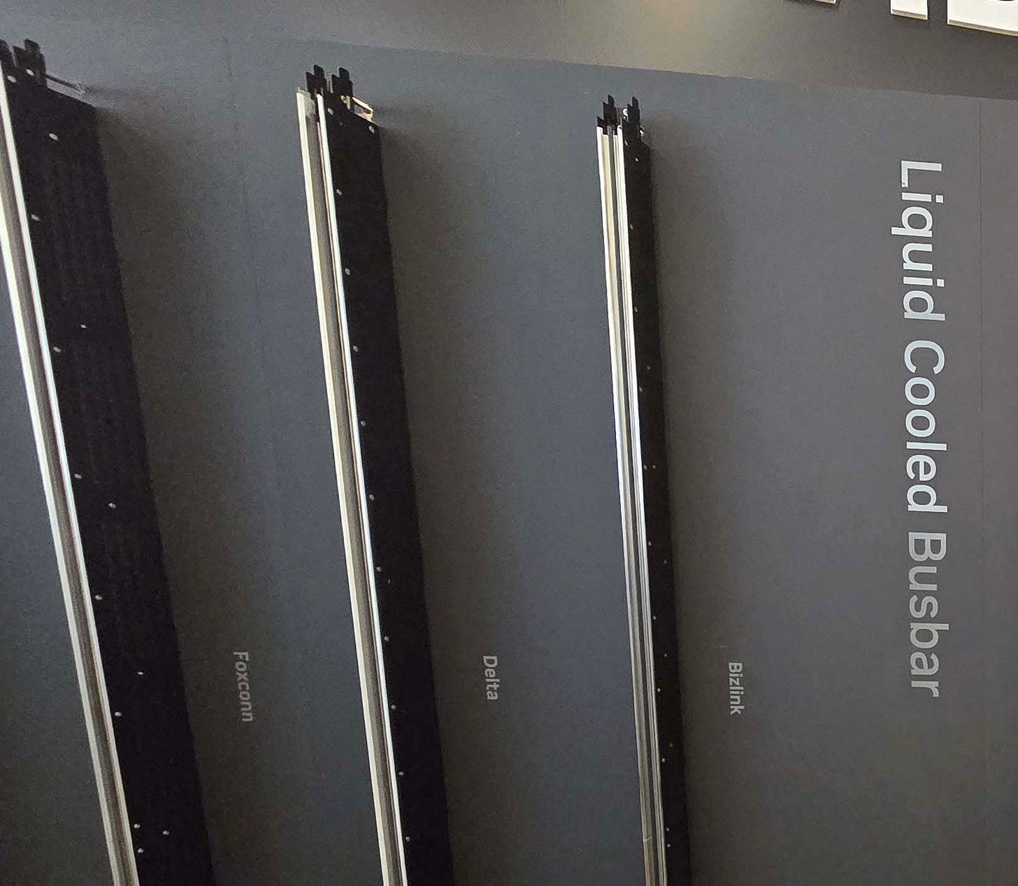 As Densities Soar, AI Racks Add Liquid-Cooled Busbars