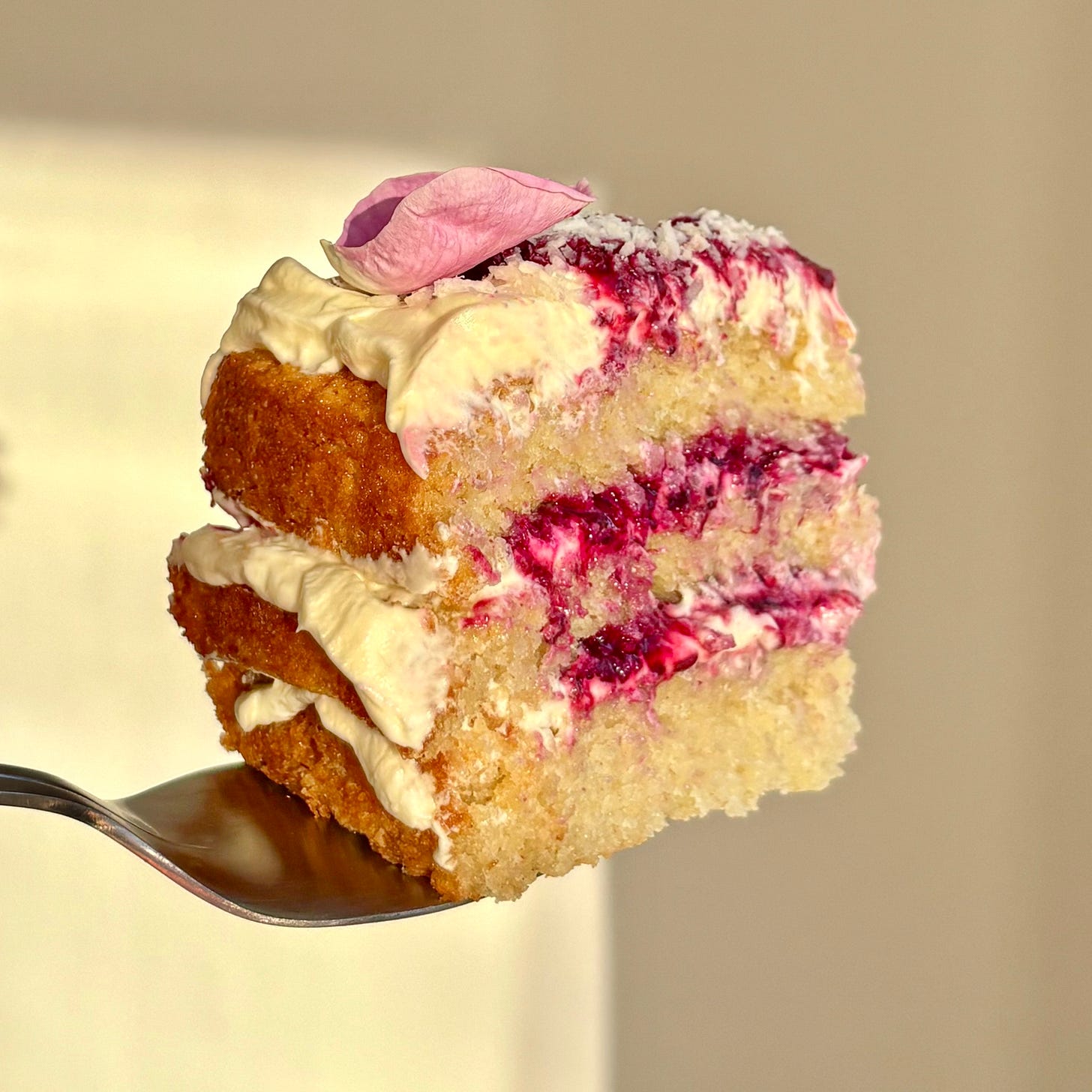 Coconut Sponge, Coconut Cream, Raspberry, Rose and Blackberry Filling.