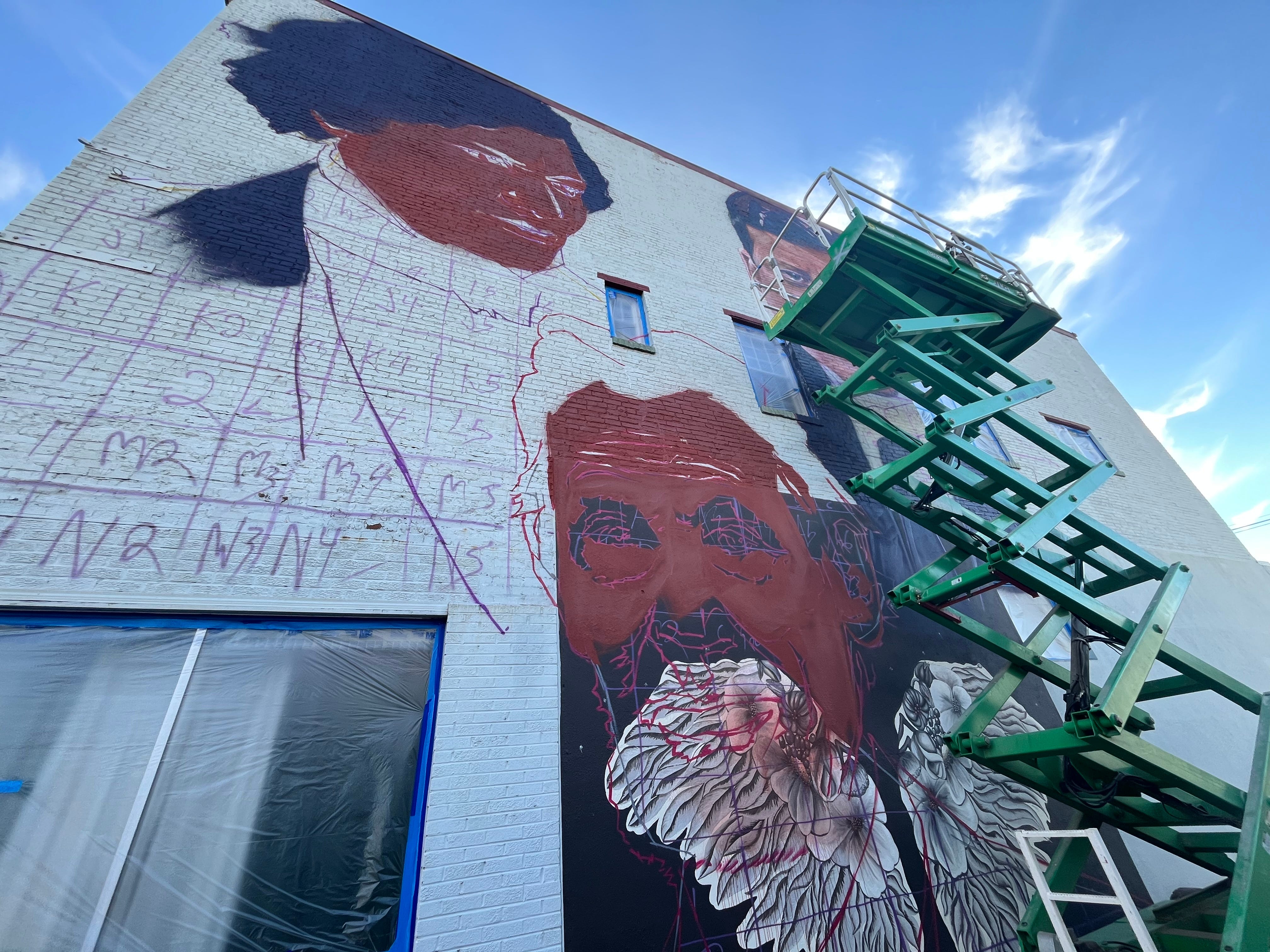 Behind that historic mural going up on Main Street