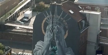 From Gift to Grief: Why the Statue of Liberty Is Covering Her Face