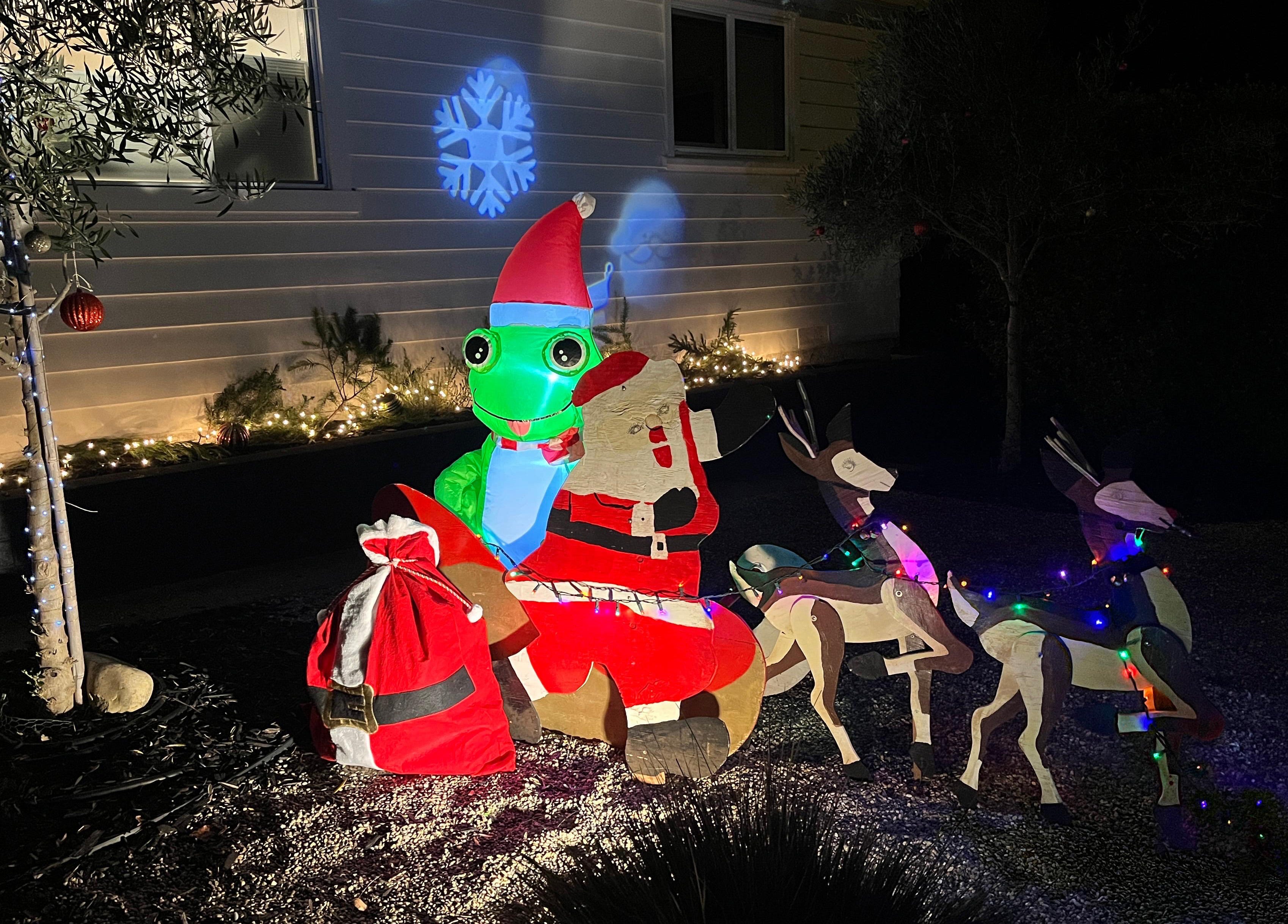 Up on the rooftop, reindeers pause, out jumps good ol' Santa Claus