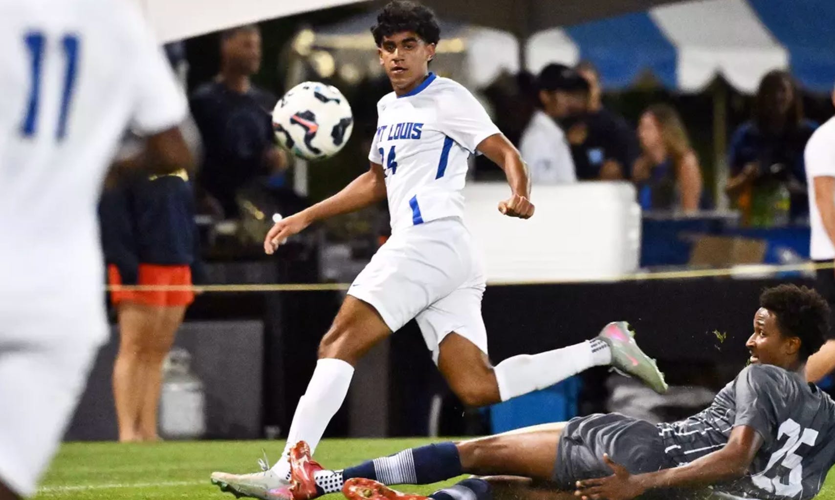 Soccer team takes over first with win - by Stu Durando