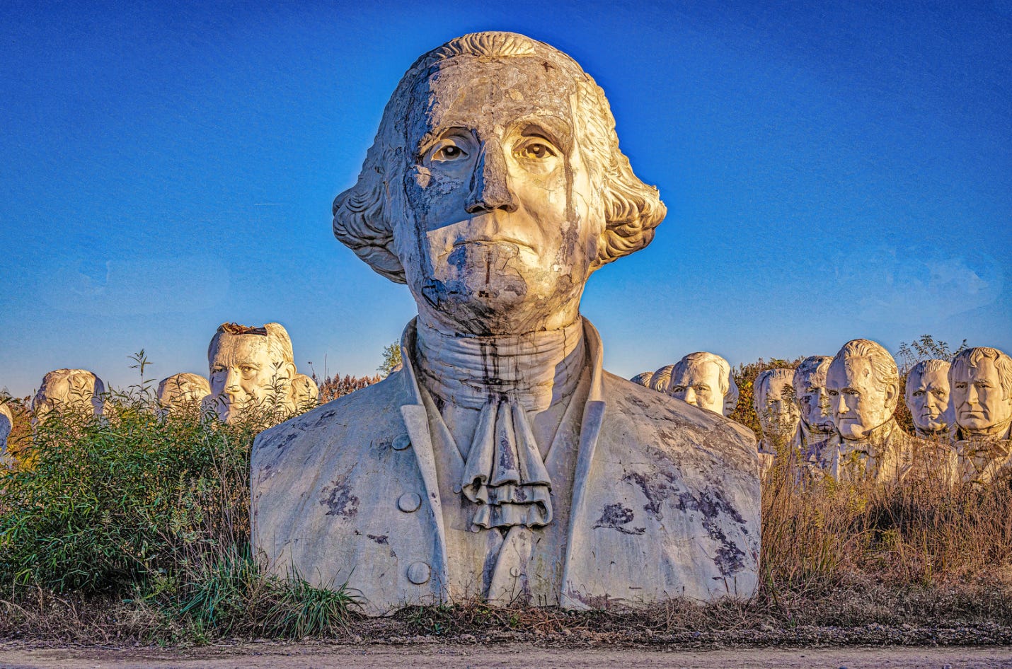 43 giant presidents' heads, sittin' in a field...