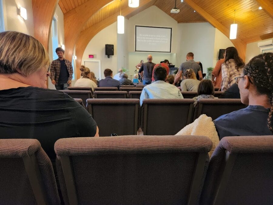 A Gallery Of The Faithful Gathering For Church.