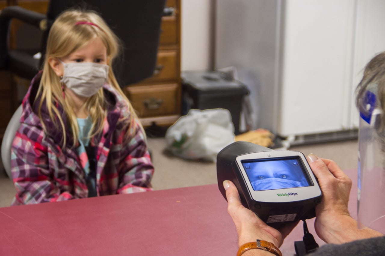 Norwich Lions provide Spot Vision screening at the Sharon Elementary school