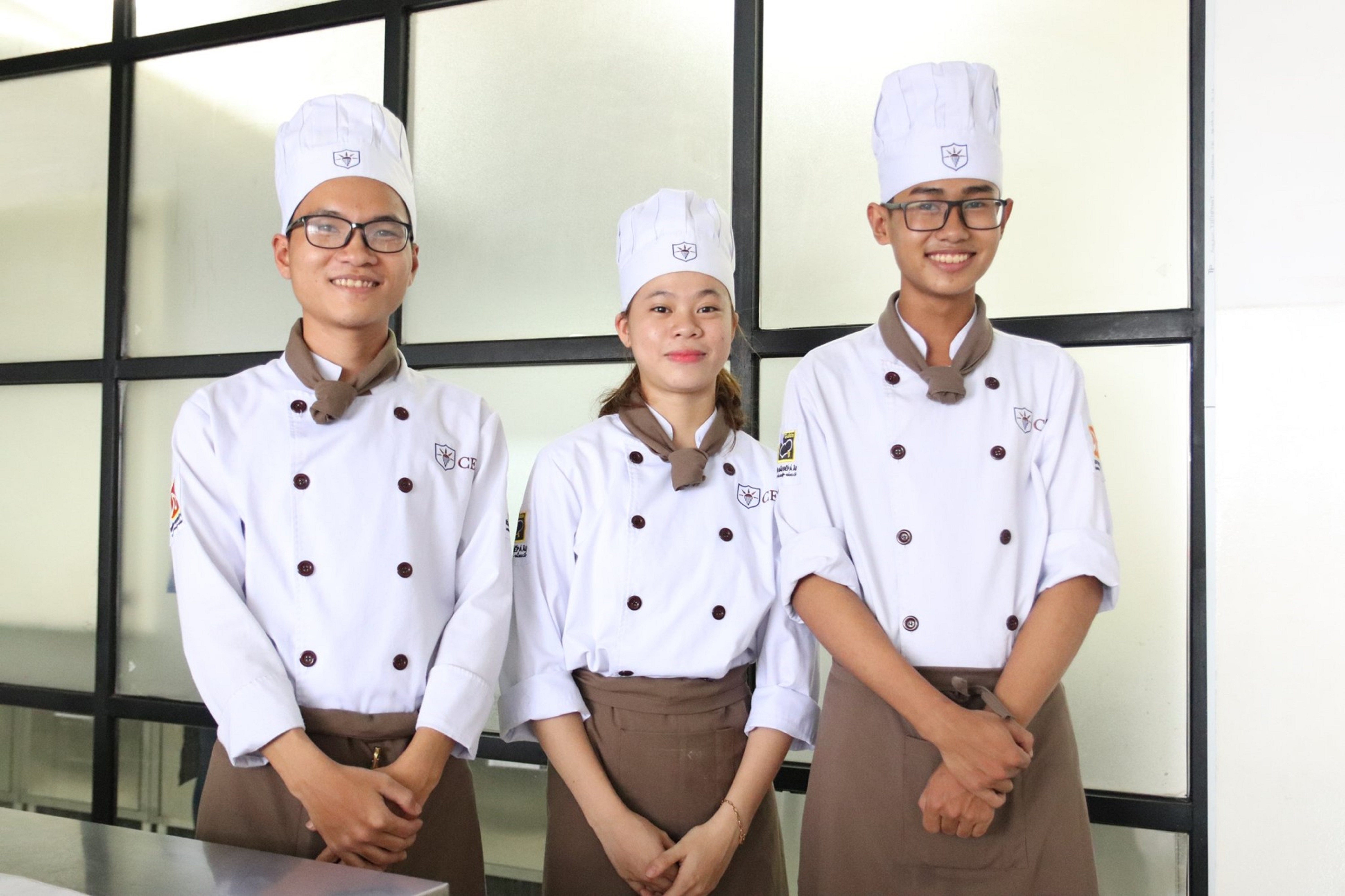 Why do chefs wear those tall hats and double-breasted jackets?