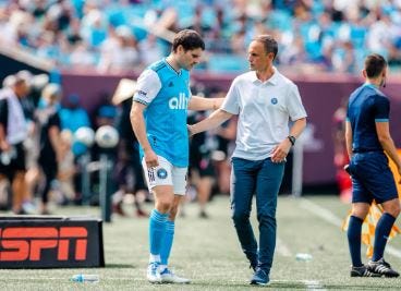 The new coach makes his mark - by Carroll Walton