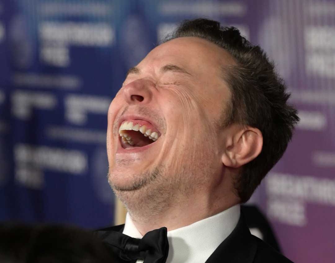 Elon Musk screams as he waves a chainsaw in the air in full-on cringe ...