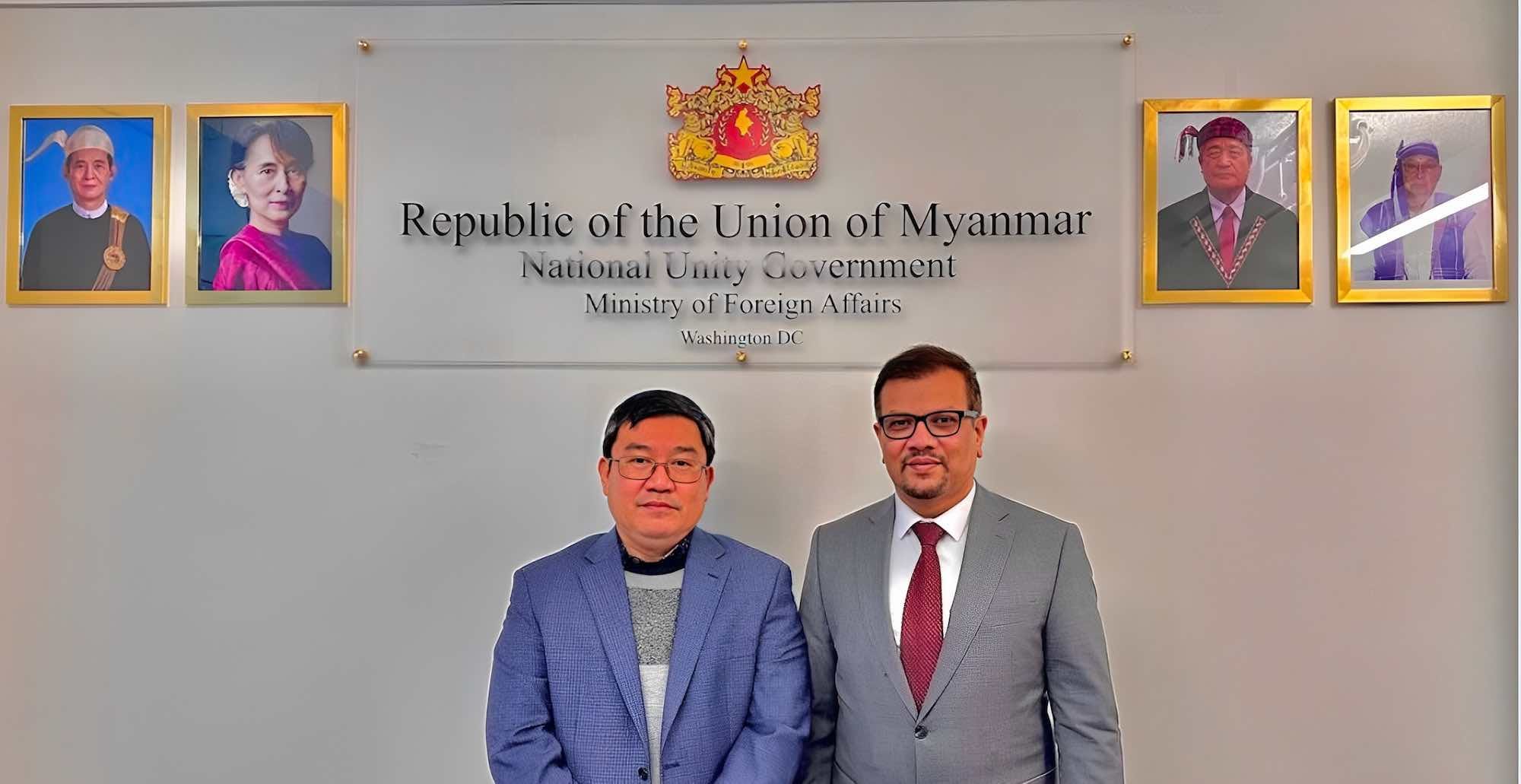 Rohingya Representative Poses in Front of Former Oppressor's Image
