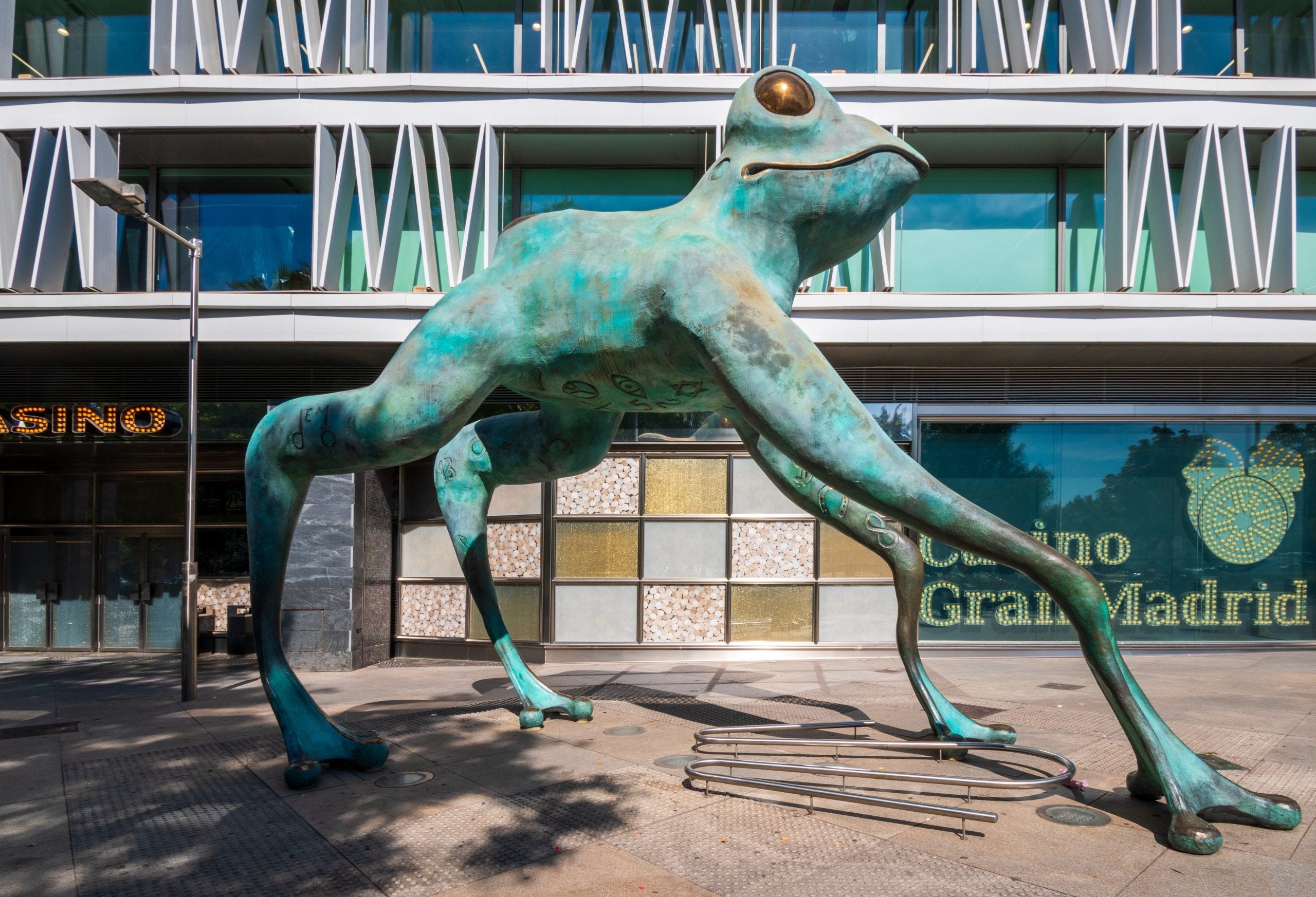 Visit Madrid's lucky frog statue: a giant good luck charm