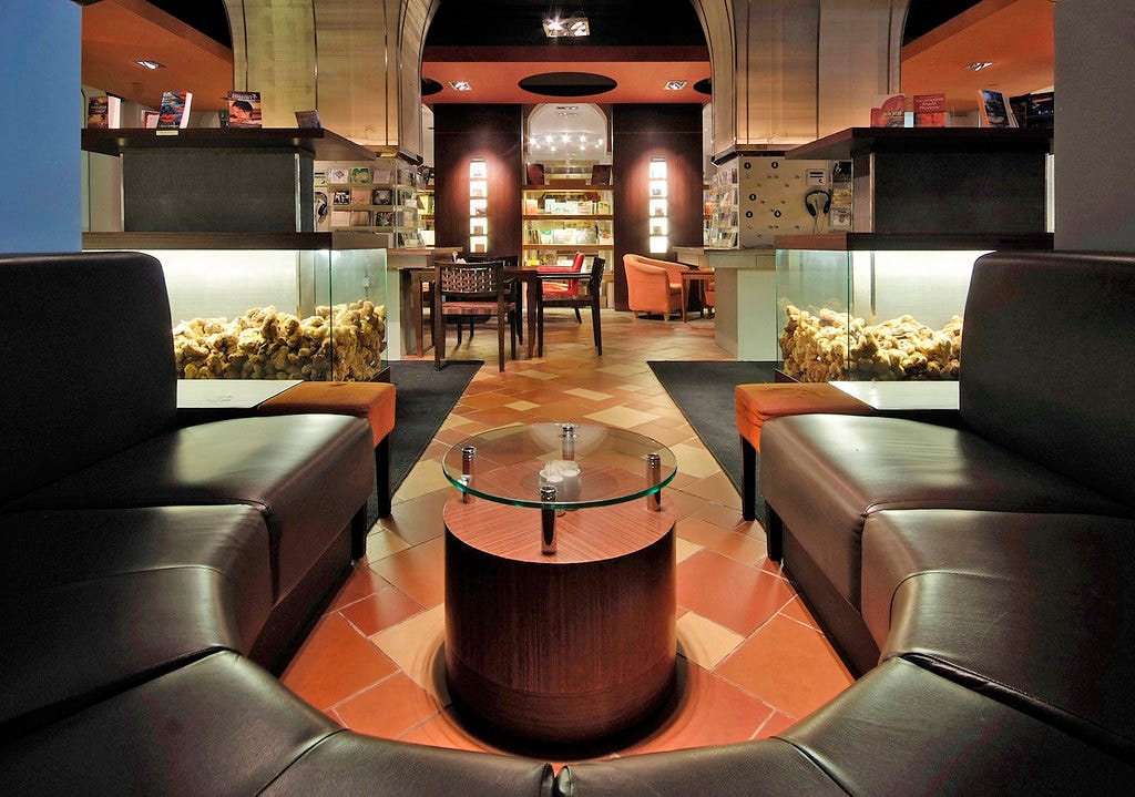 From Competing Digital Cages to Cooperative Digital Cafes