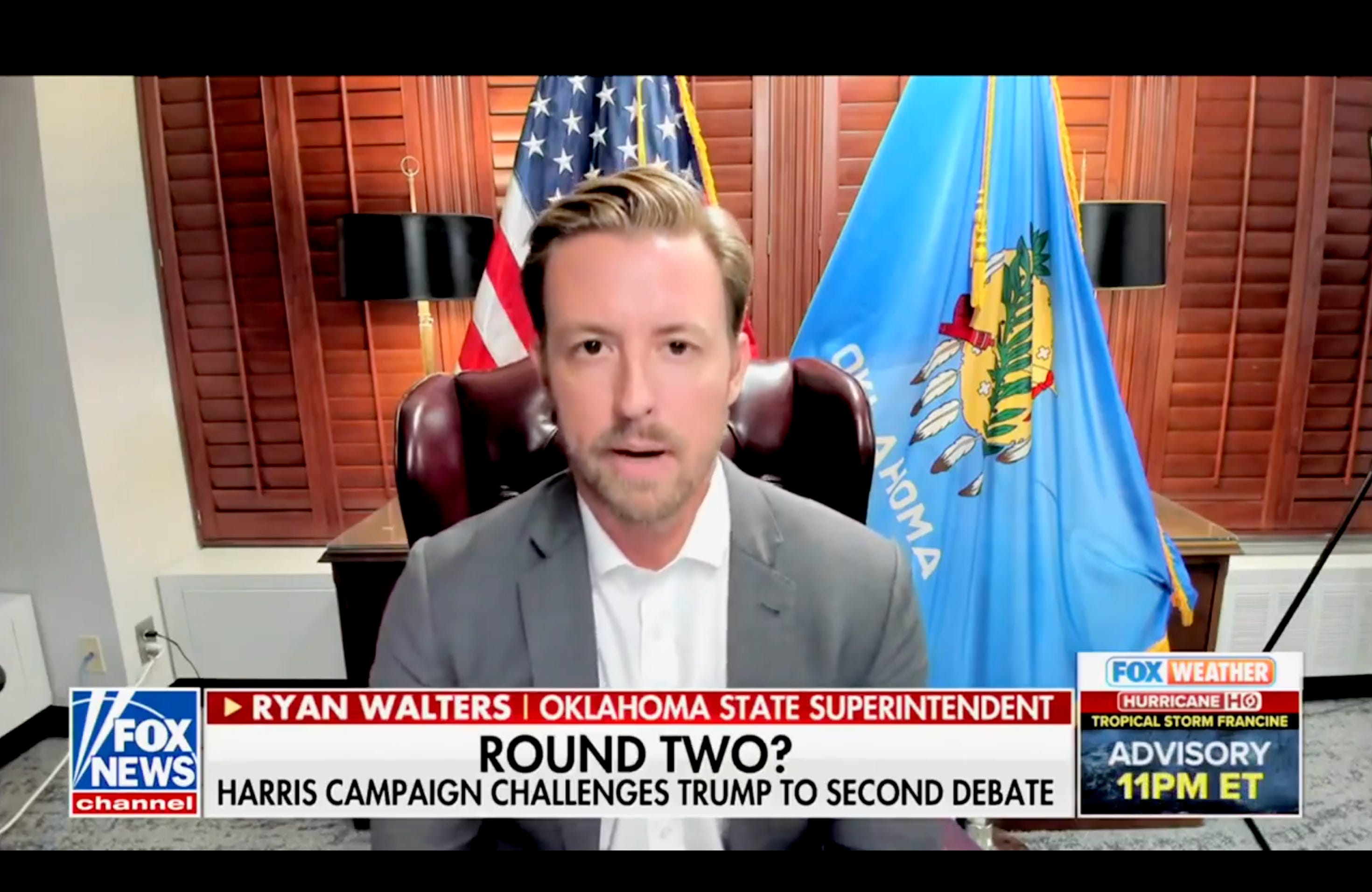 Ryan Walters appears to be surrounded