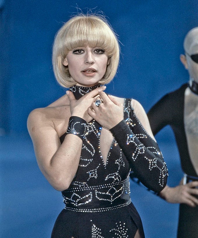 A Deep Dive into Raffaella Carrà: Her Costumes