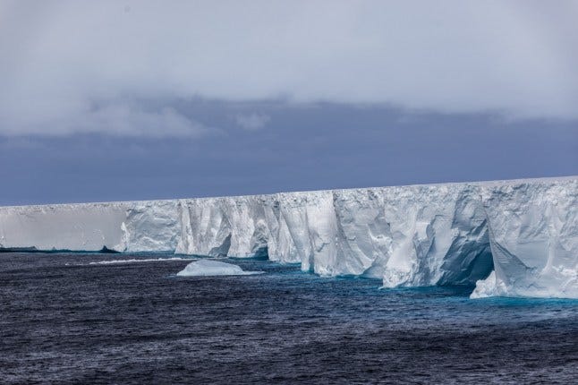 Mega 1,000,000,000,000 ton iceberg drifting in the ocean after breaking ...