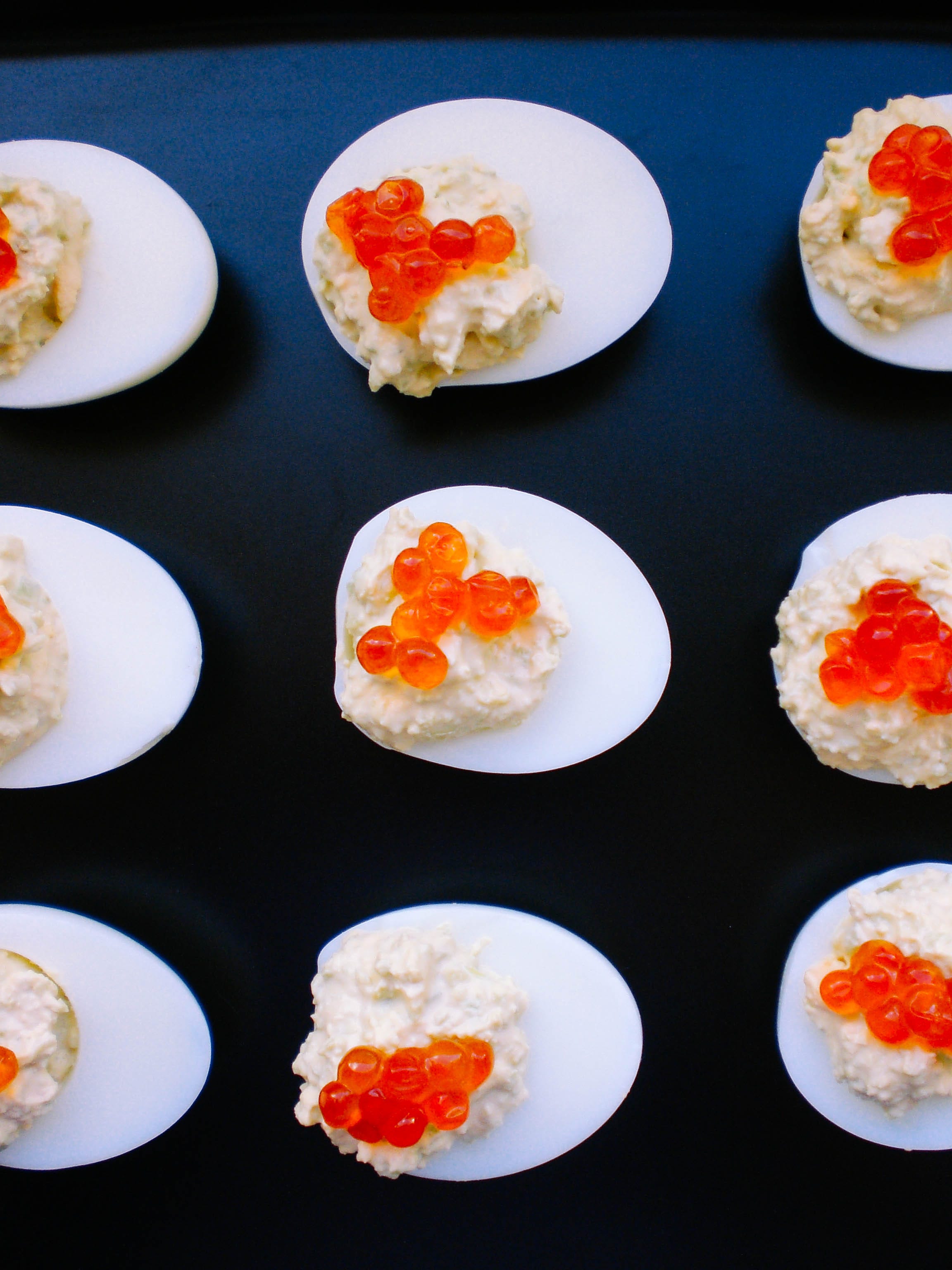 Deviled eggs with avocado, crème fraîche and salmon roe