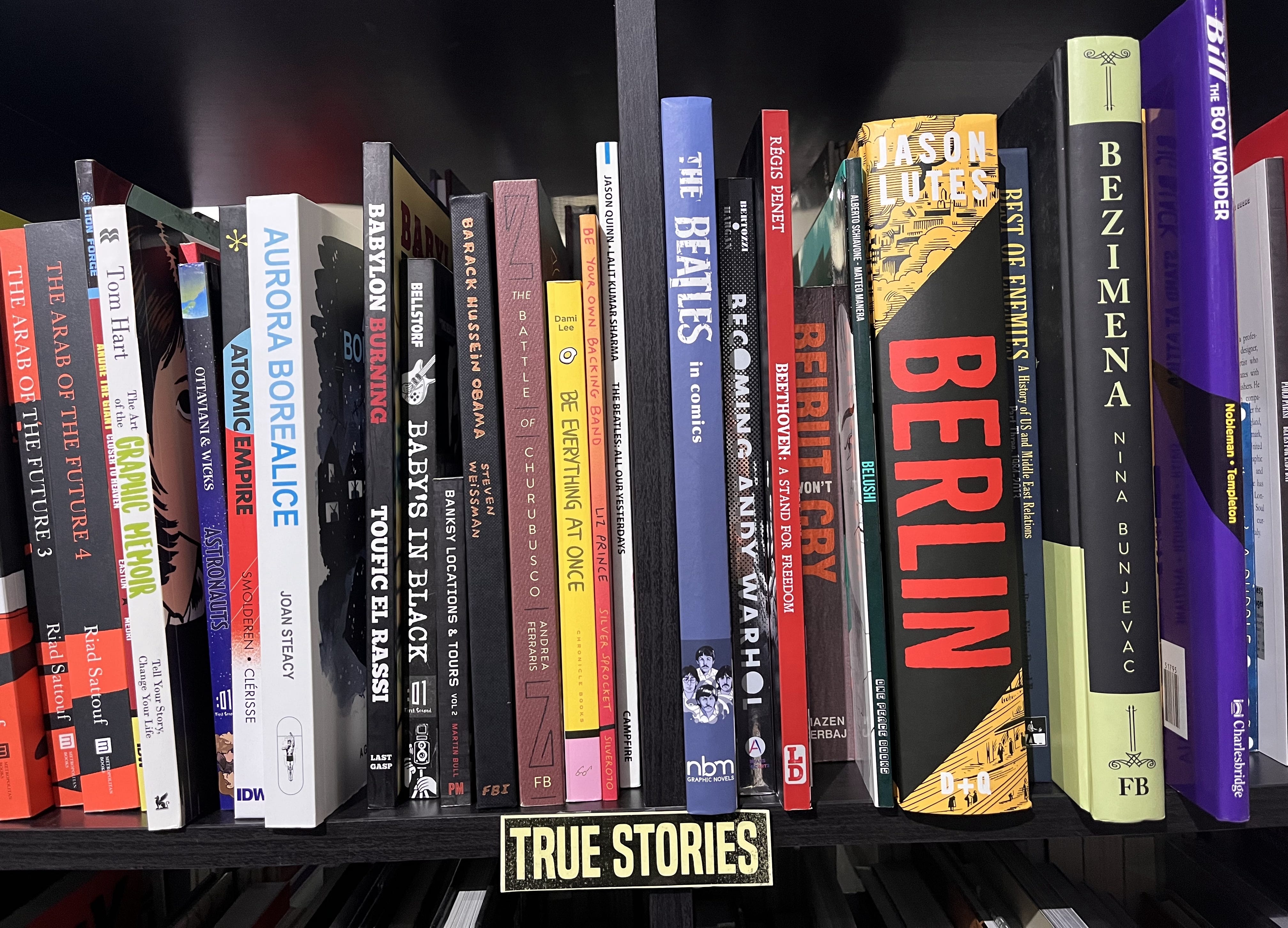 Scoping out the "True Stories" shelves at Crescent City Comics