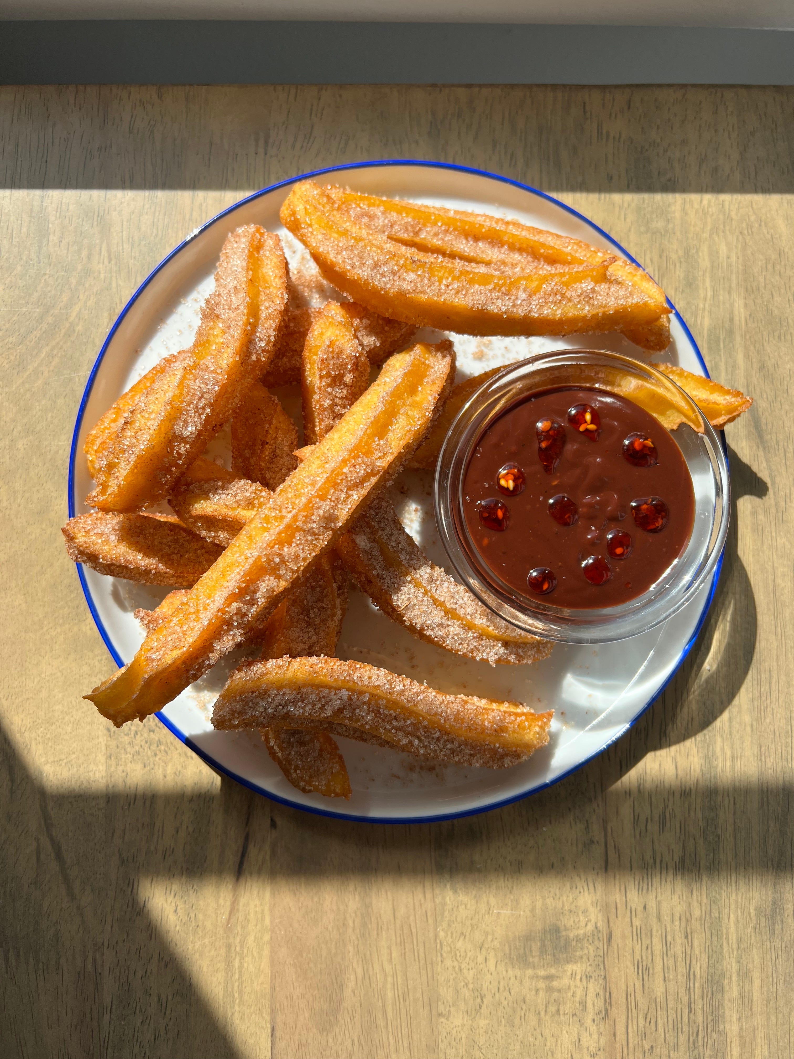 Sweet potato churros with chili crisp chocolate sauce