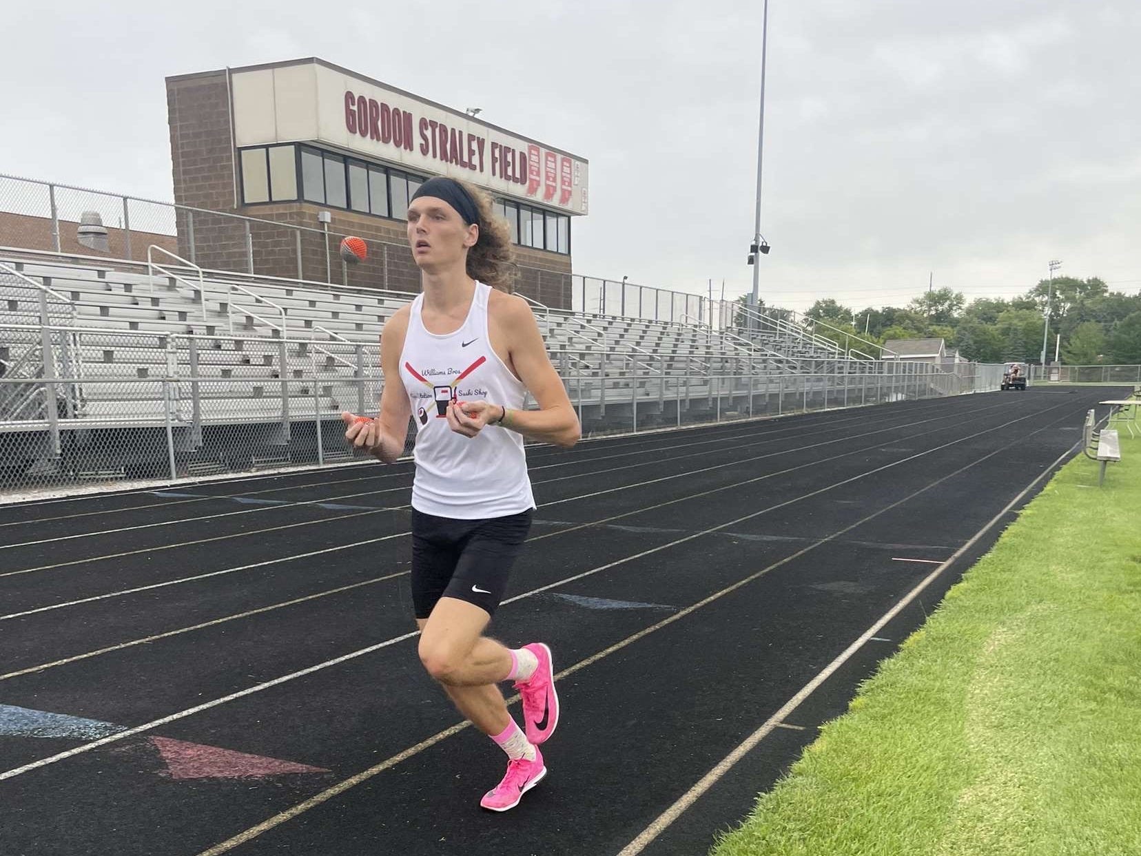 Harrison grad, Purdue runner claims Guinness record with ‘joggling’ mile