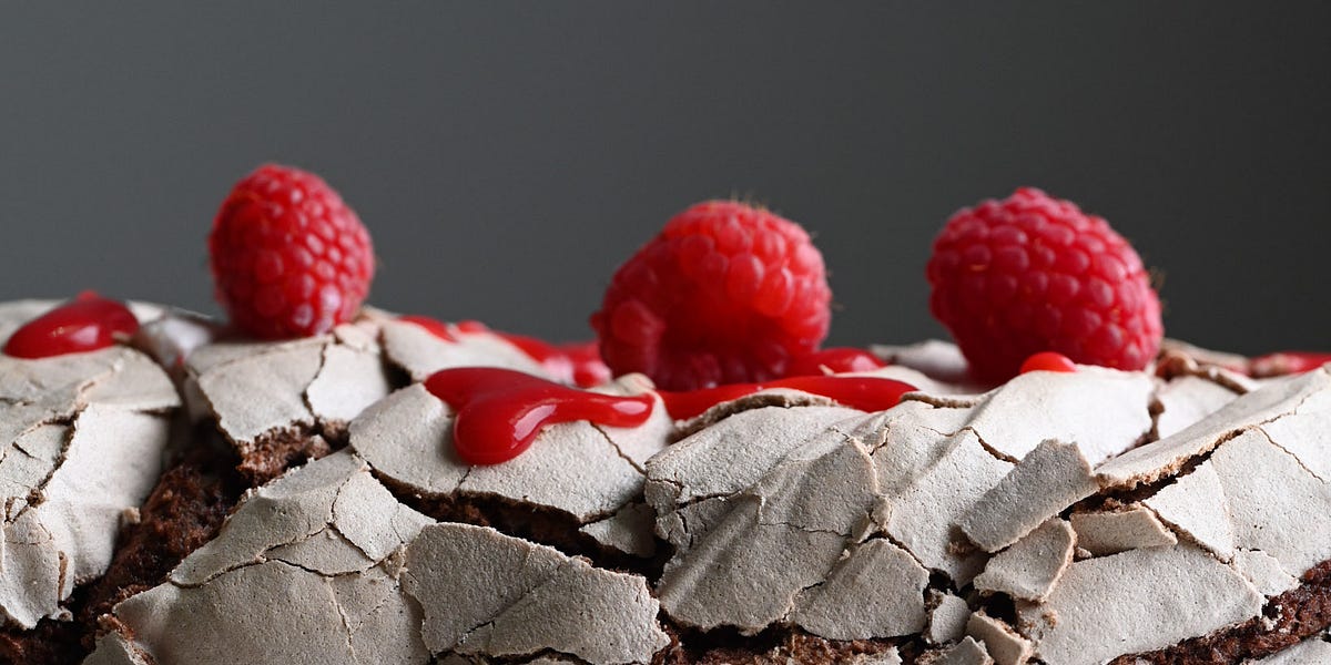 Chocolate Meringue Roulade with Raspberries & Whipped Cream