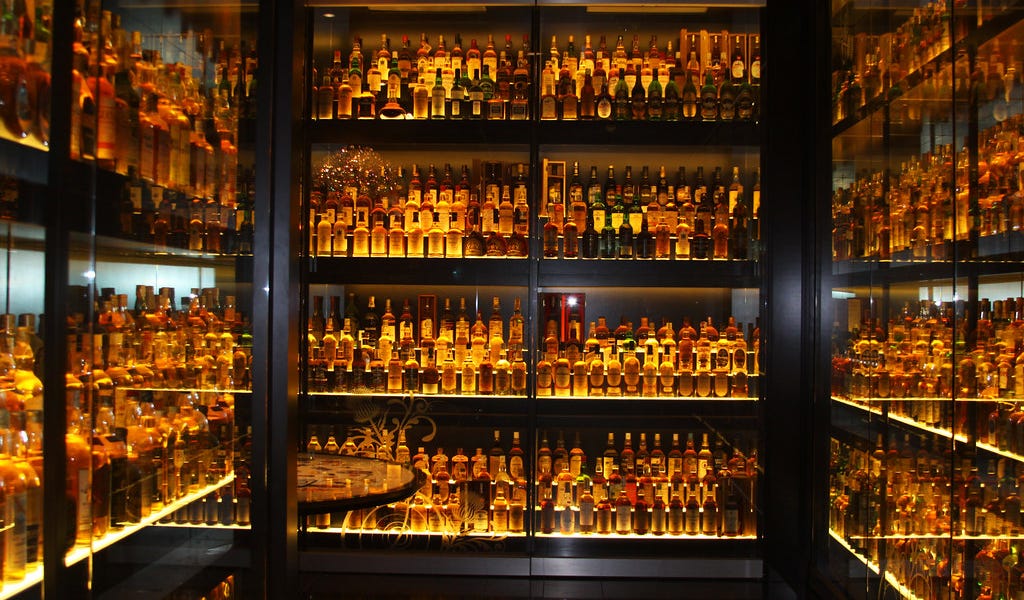 Decoding Whiskey Auctions: From Headline Prices to True Valuations