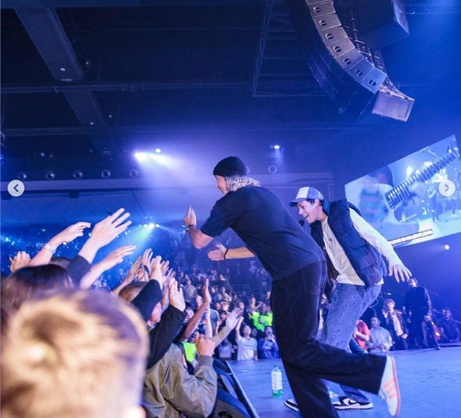 Hillsong Leader Phil Dooley Crowdsurfs During Worship Event