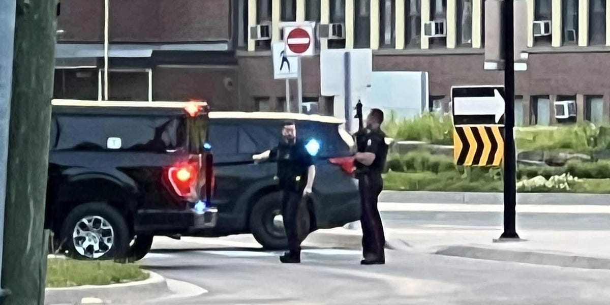 Armed officers cordon off downtown area - by Don MacPherson