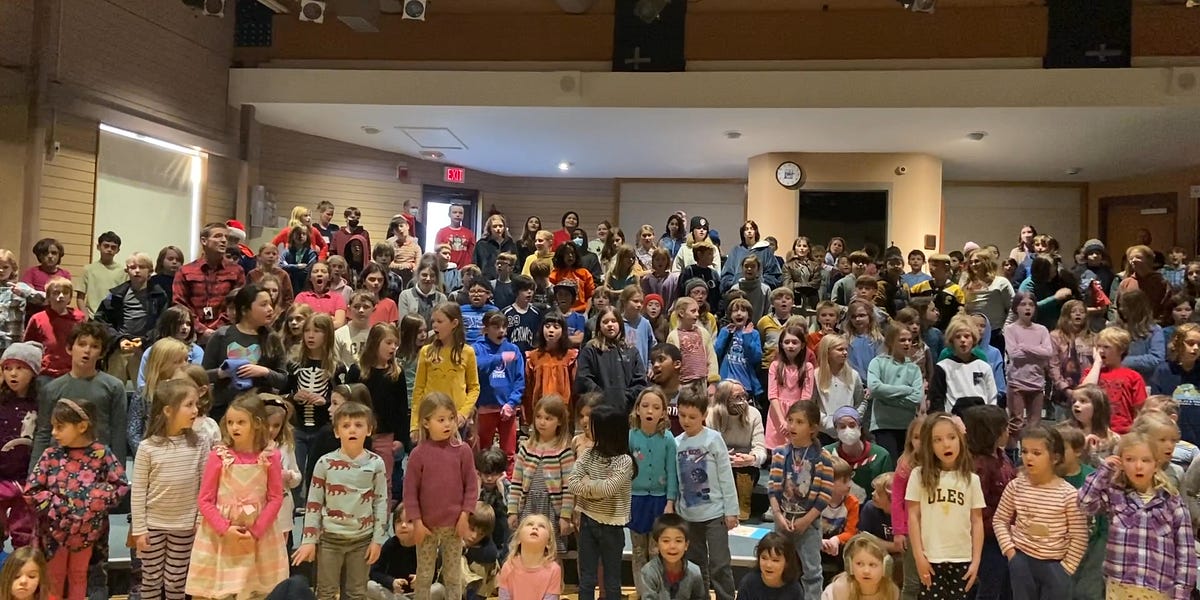 Marion Cross students perform a song in honor of a Marion Cross staff ...