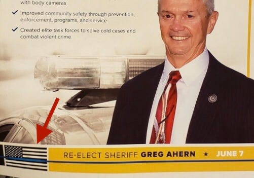 Sheriff Greg Ahern prominently features controversial 'Thin Blue Line ...