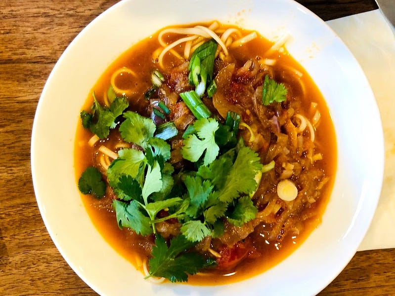 Udon in buttery tomato and soy broth - by Ellisa Calder