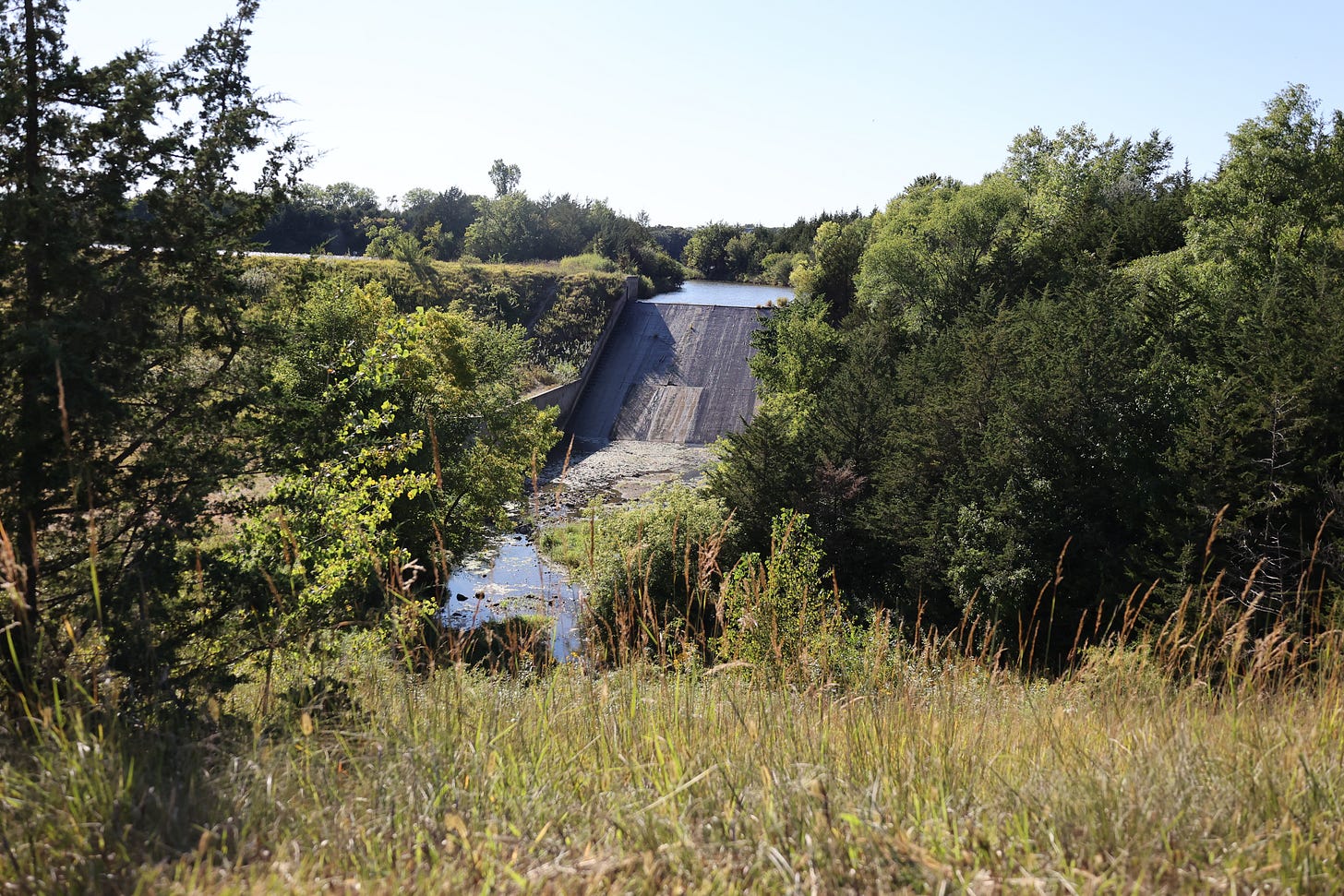 Scarred hillside evidence $5M spillway project at Lake Alvin nearing