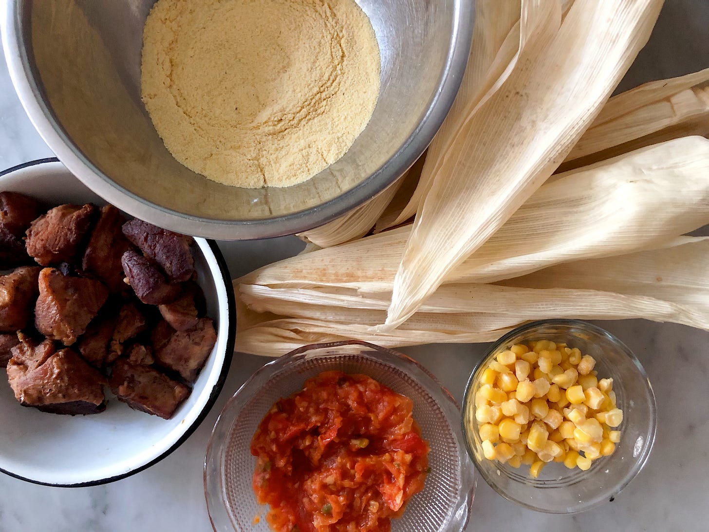 CAREFULLY WRAPPED FOOD: A MULTICULTURAL FAMILY. Tamalli, humita, bubuto ...