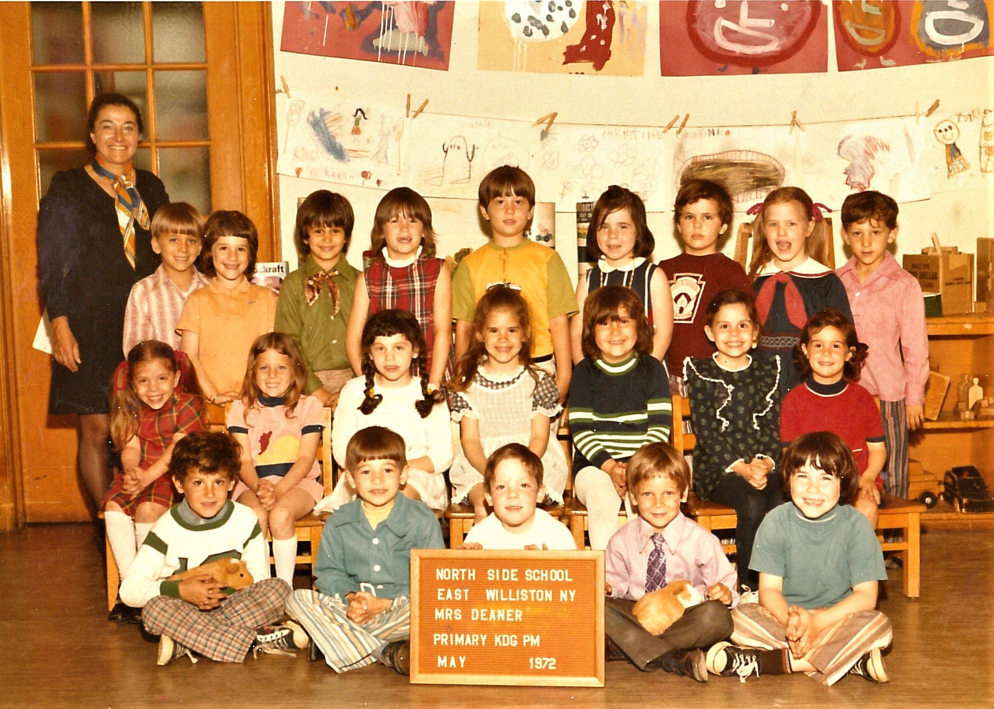 Matthew is the tall guy in the middle of the back row, wearing yellow.