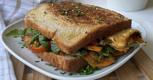 Asian-Inspired Breakfast Sandwich with Omelette, Veggies, and Avocado