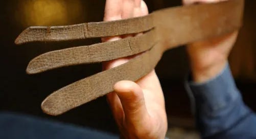 Who produced the belts sold to Scottish teachers?